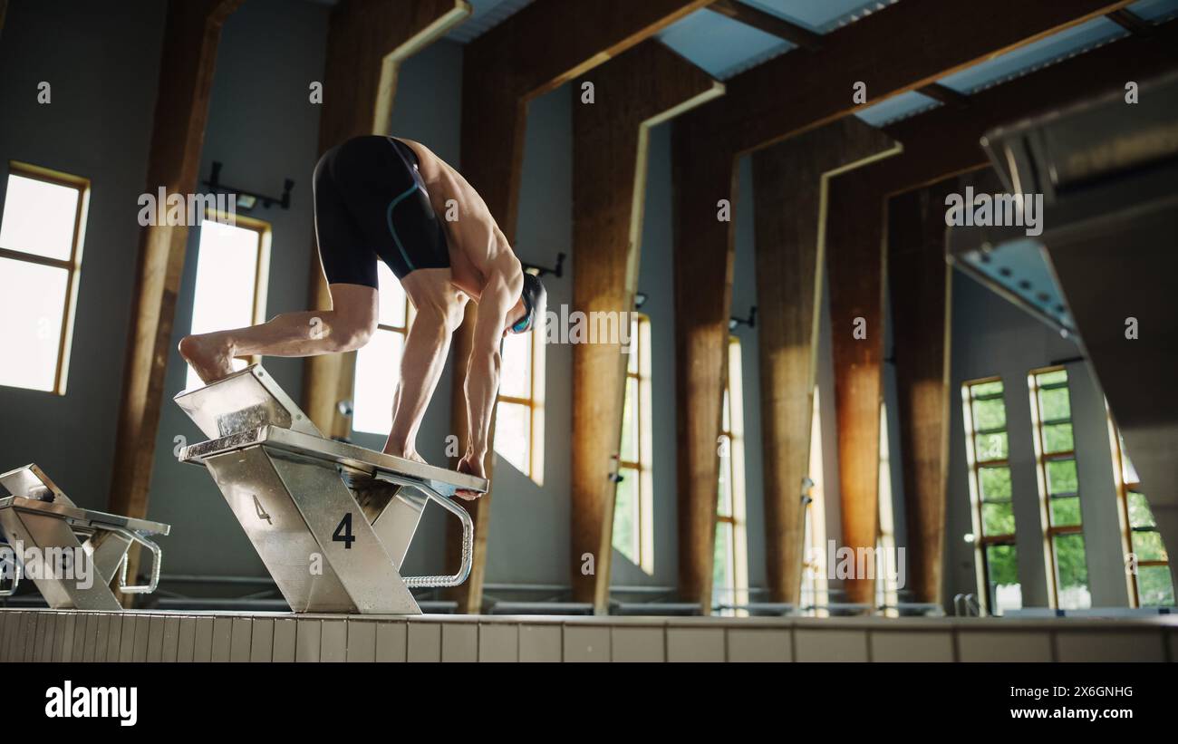 Athletic Male Swimmer Standing on a Starting Block, Ready to Jump into ...