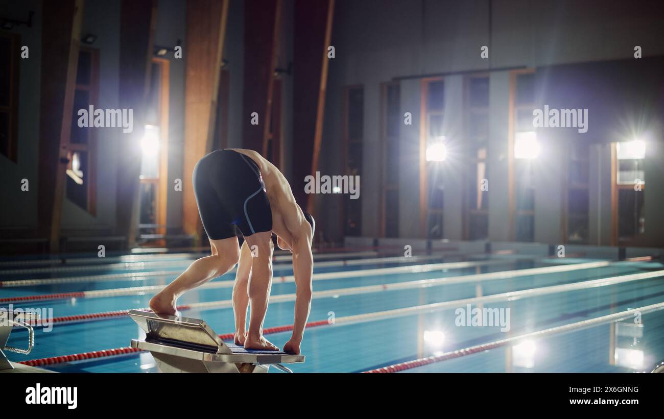 Athletic Male Swimmer Stands on a Starting Block, Ready to Dive into ...
