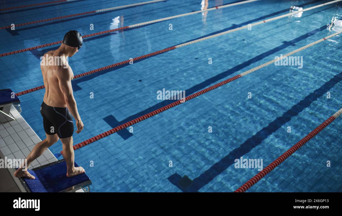 Athletic Male Swimmer Stands on a Starting Block, Ready to Dive into ...