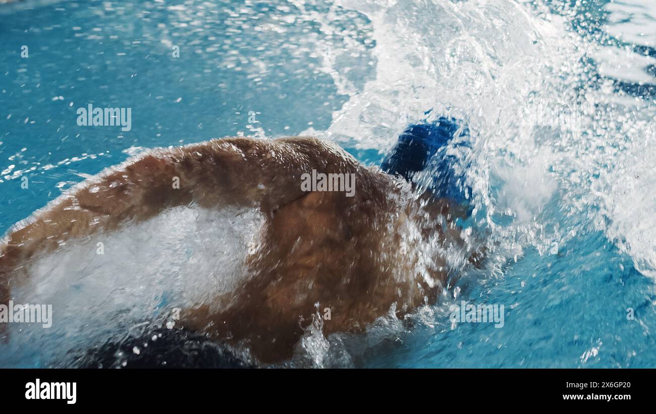 Male Swimmer Swimming in Olympic Pool. Professional Athlete Performing ...
