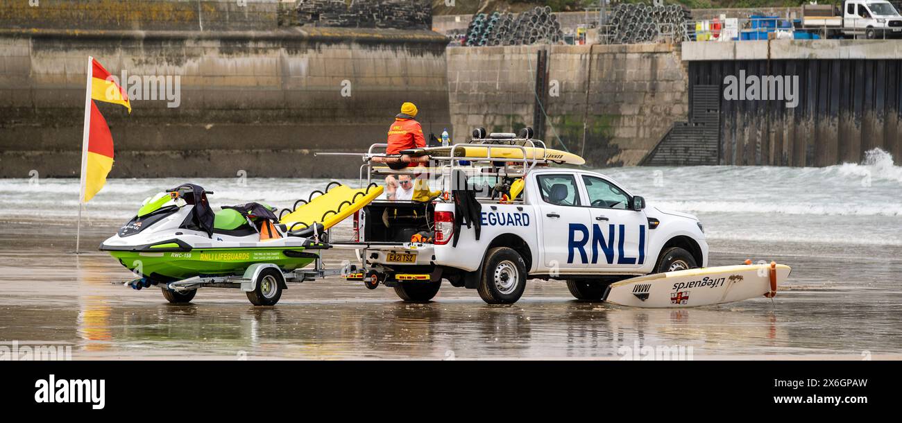 A panoramic image of a RNLI lifeguard sitting on an emergency response ...
