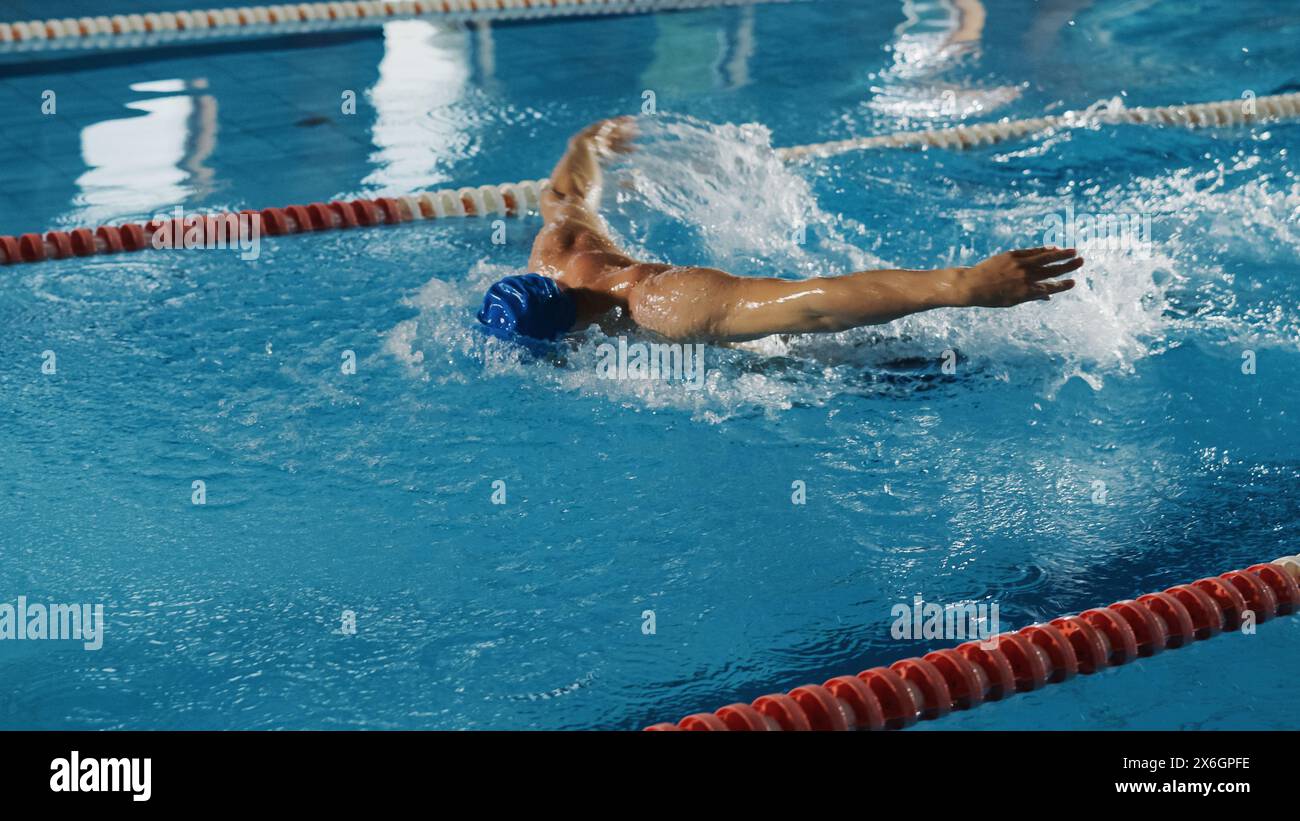 Successful Male Swimmer Racing, Swimming in Olympic Swimming Pool ...