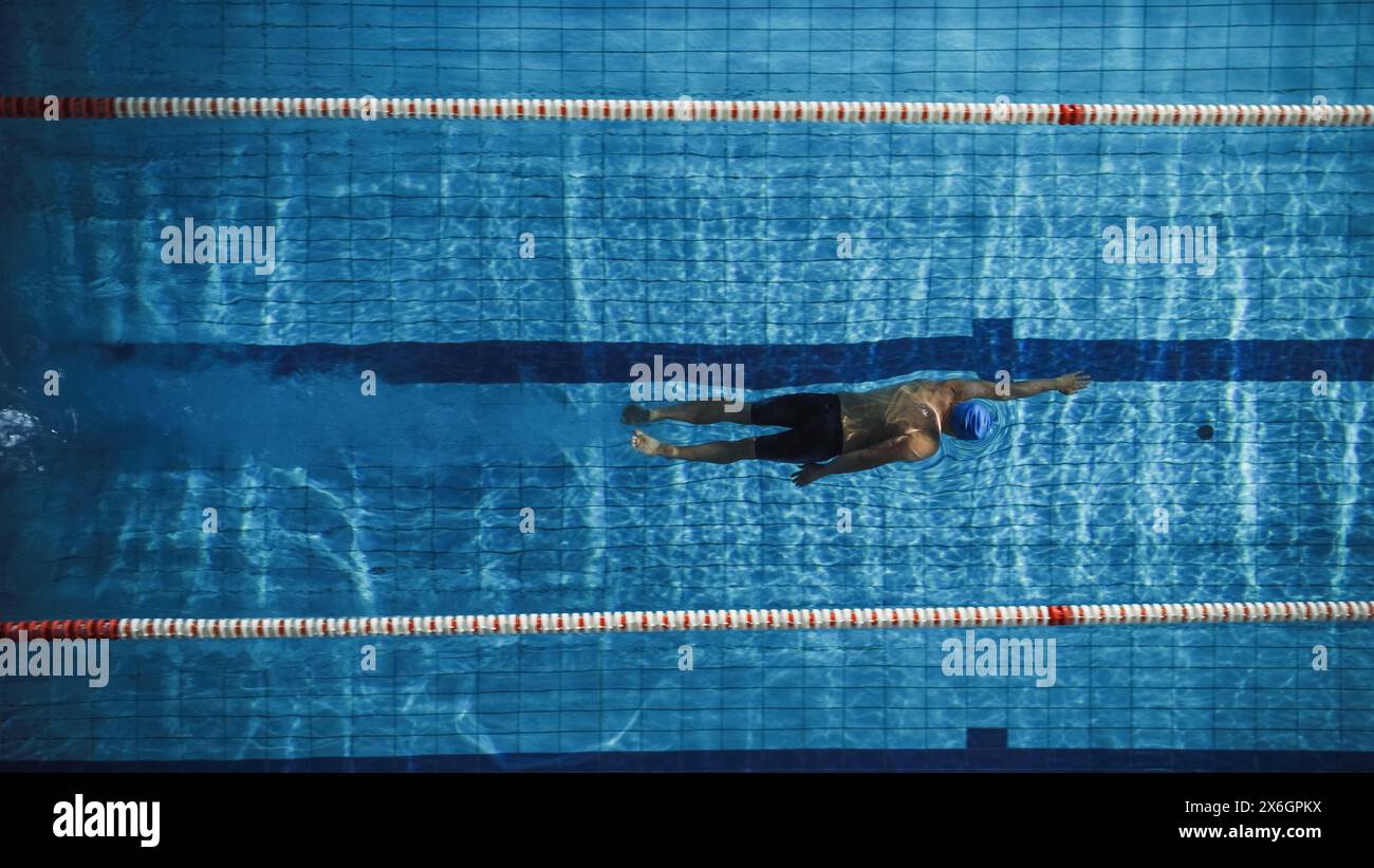Aerial Top View Male Swimmer Swimming in Swimming Pool. Professional ...