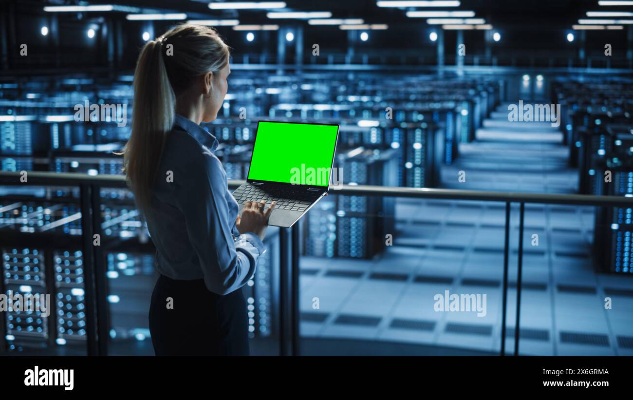 Female It Specialist Using Chroma Key Laptop in Data Center. Big Server ... Female It Specialist Using Chroma Key Laptop in Data Center. Big Server ...