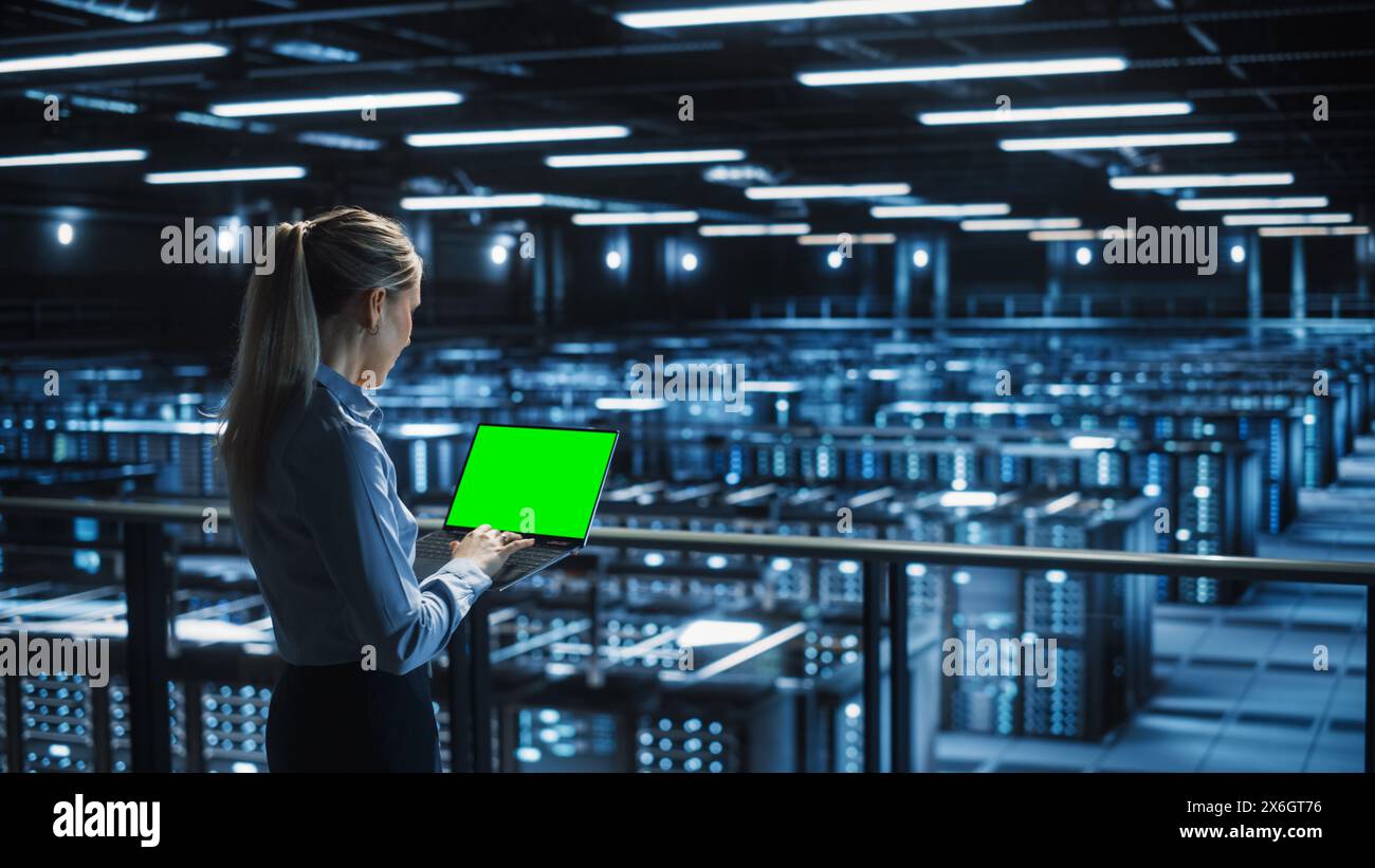 Female It Specialist Using Chroma Key Laptop in Data Center. Big Server ... Female It Specialist Using Chroma Key Laptop in Data Center. Big Server ...