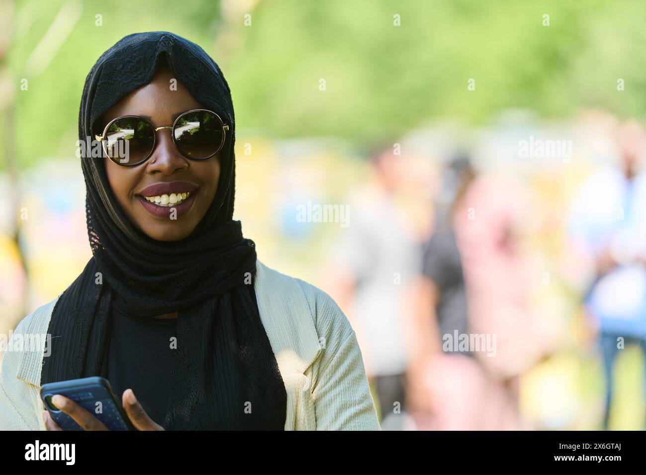 Empowered Middle Eastern Muslim Woman in Hijab Balances Modern ...