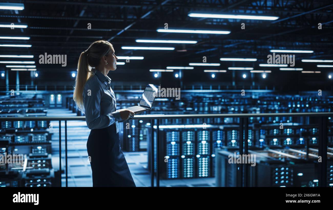 Data Center Female It Specialist Uses Laptop Computer Information Technology Engineer