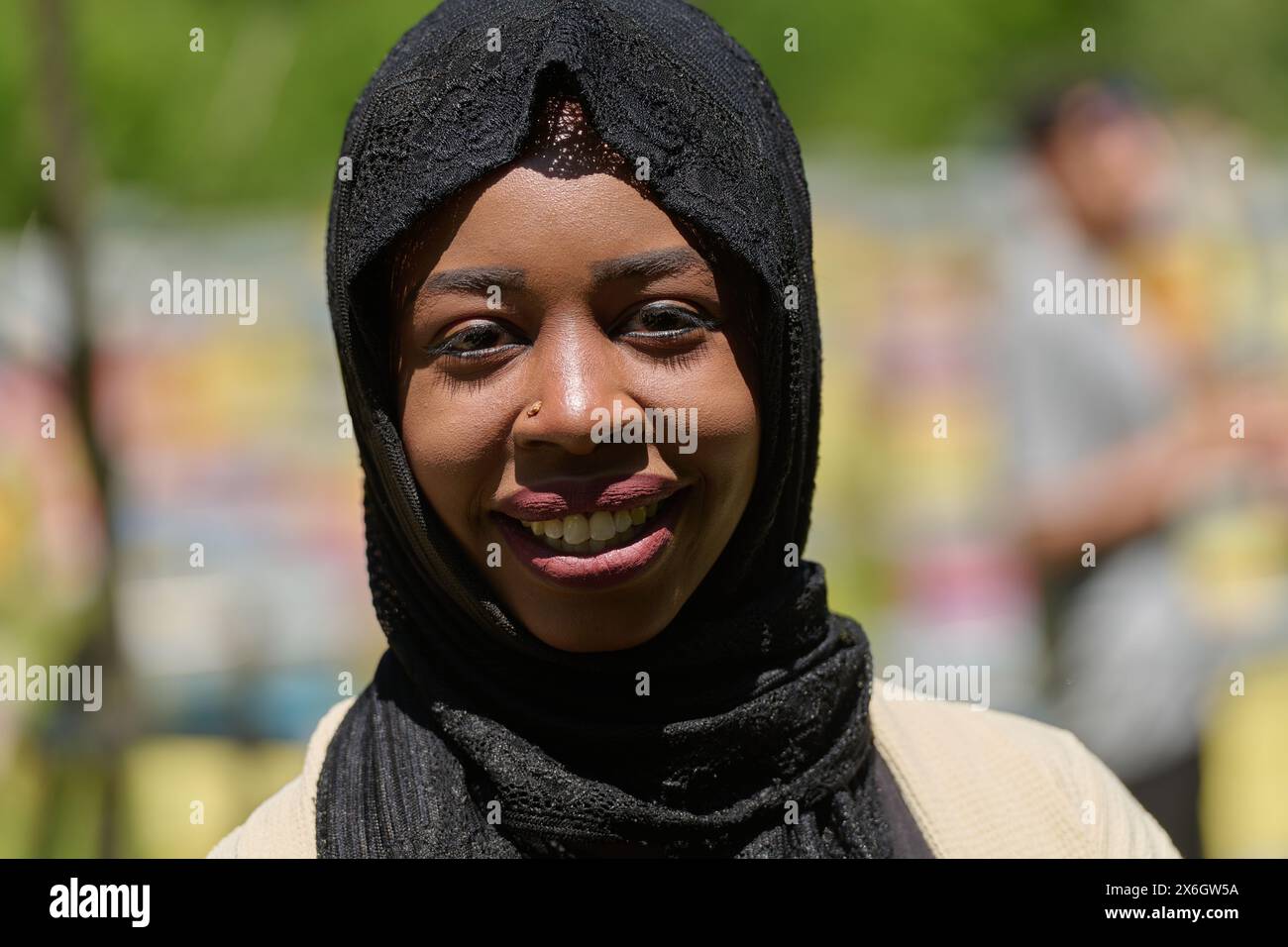 Joyful Middle Eastern Muslim Woman in Hijab Smiling Brightly in a ...
