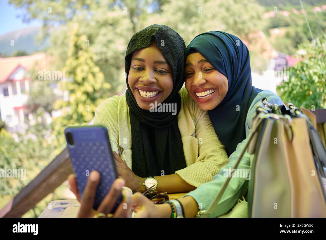 Middle Eastern Muslim Women Capturing Selfies in Serene Surroundings ...