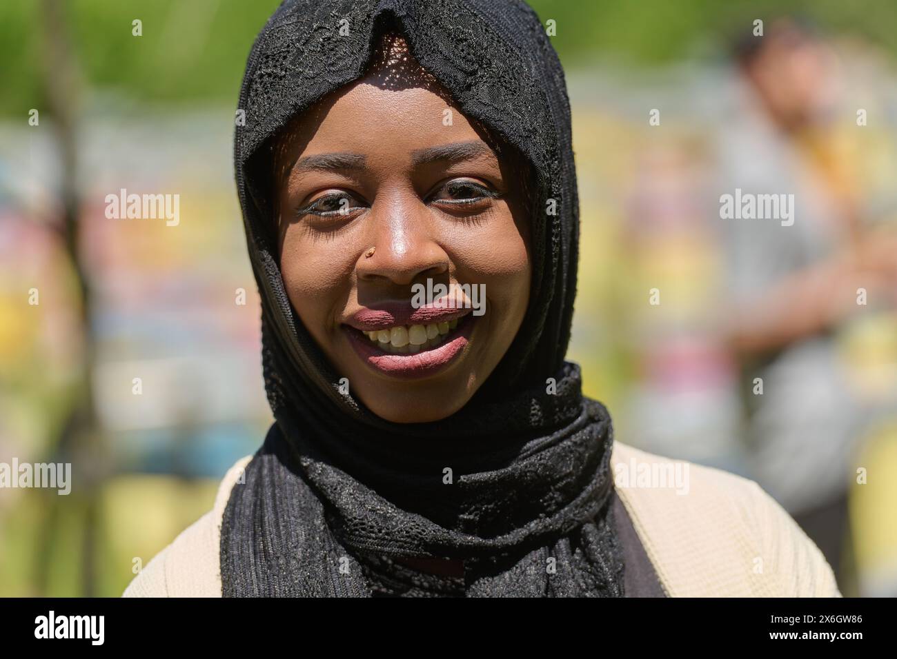 Joyful Middle Eastern Muslim Woman in Hijab Smiling Brightly in a ...