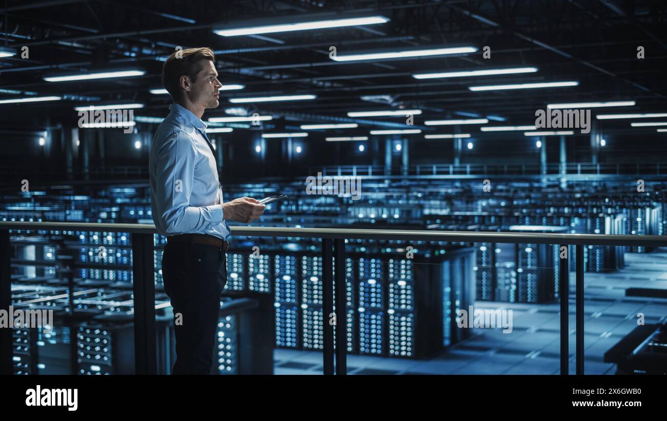 Data Center Engineer Using Digital Tablet Computer, Maintenance Specialist. High-Tech ...