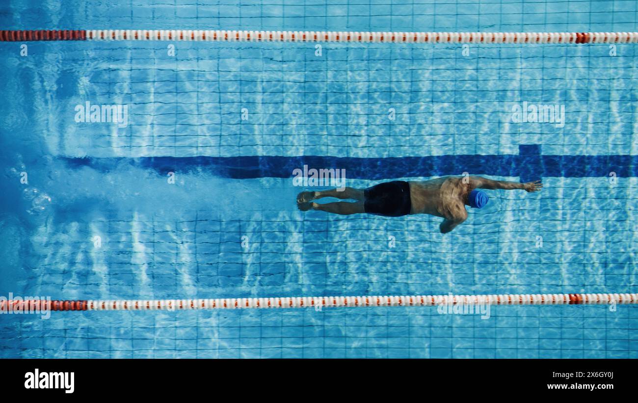 Aerial Top View Male Swimmer Swimming in Swimming Pool. Professional ...