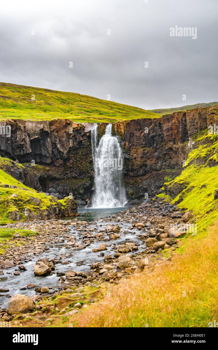 Cover page with copy space, Gufu waterfall with dramatic sky and green ...