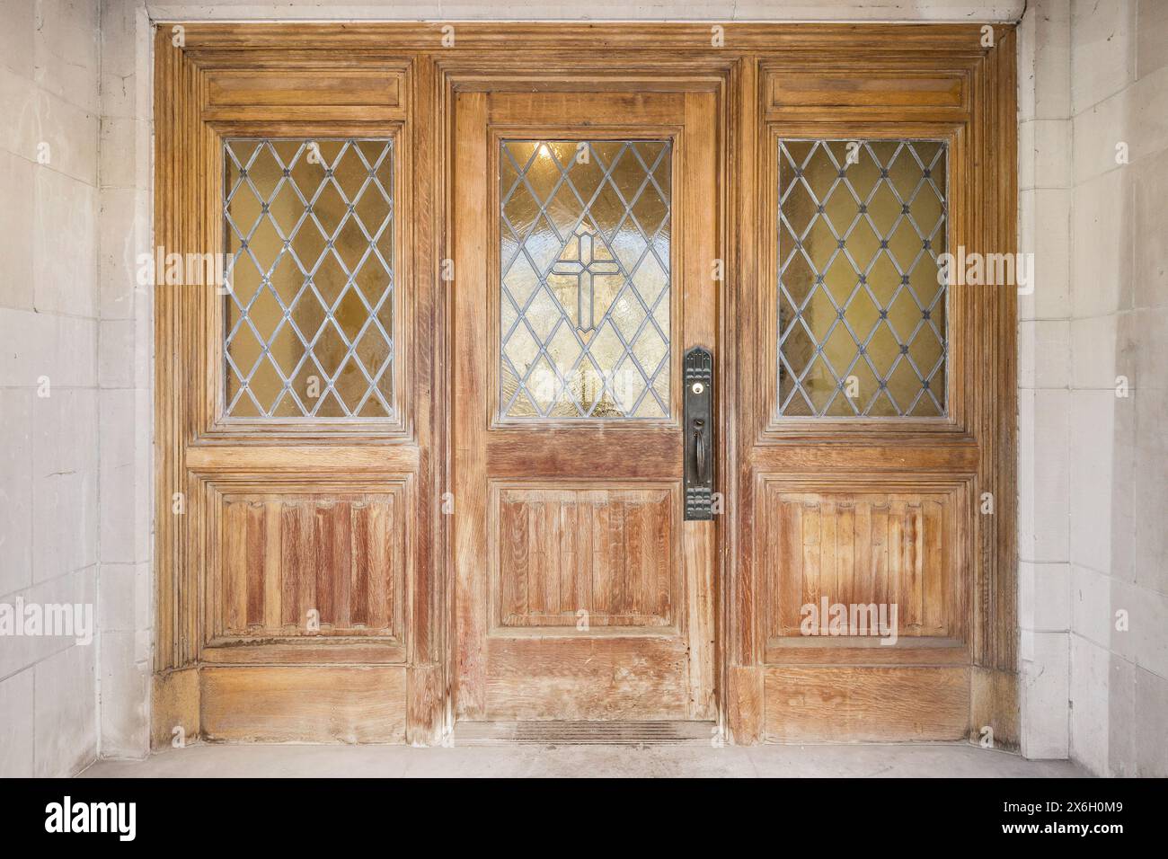 The wooden front door of a reformed church turned into a home with a ...