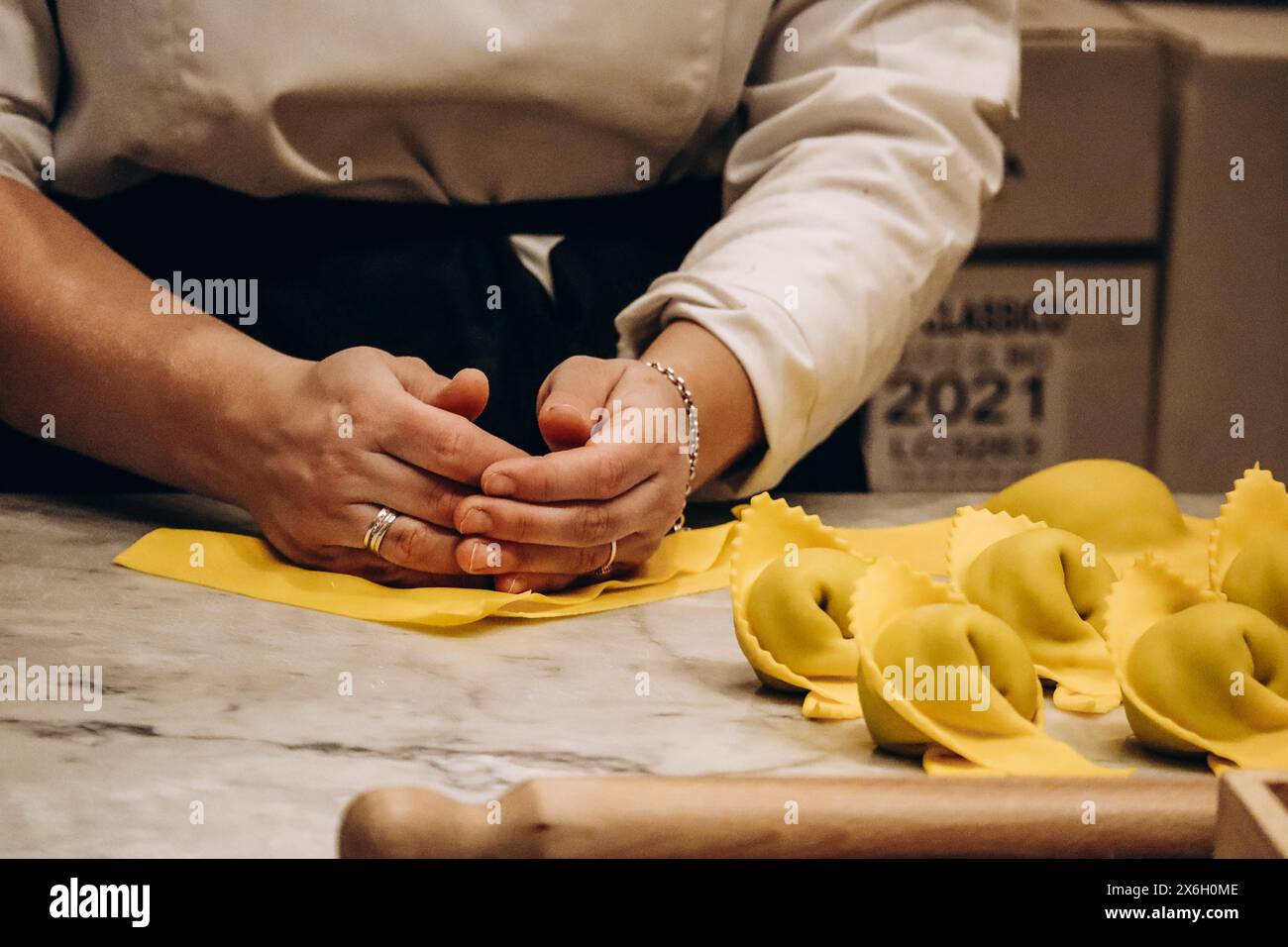 The chef prepares the cappellacci with ricotta and spinach Stock Photo ...
