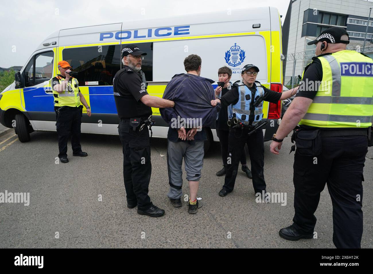 Pro-Palestine campaigners are removed by police during a protest ...