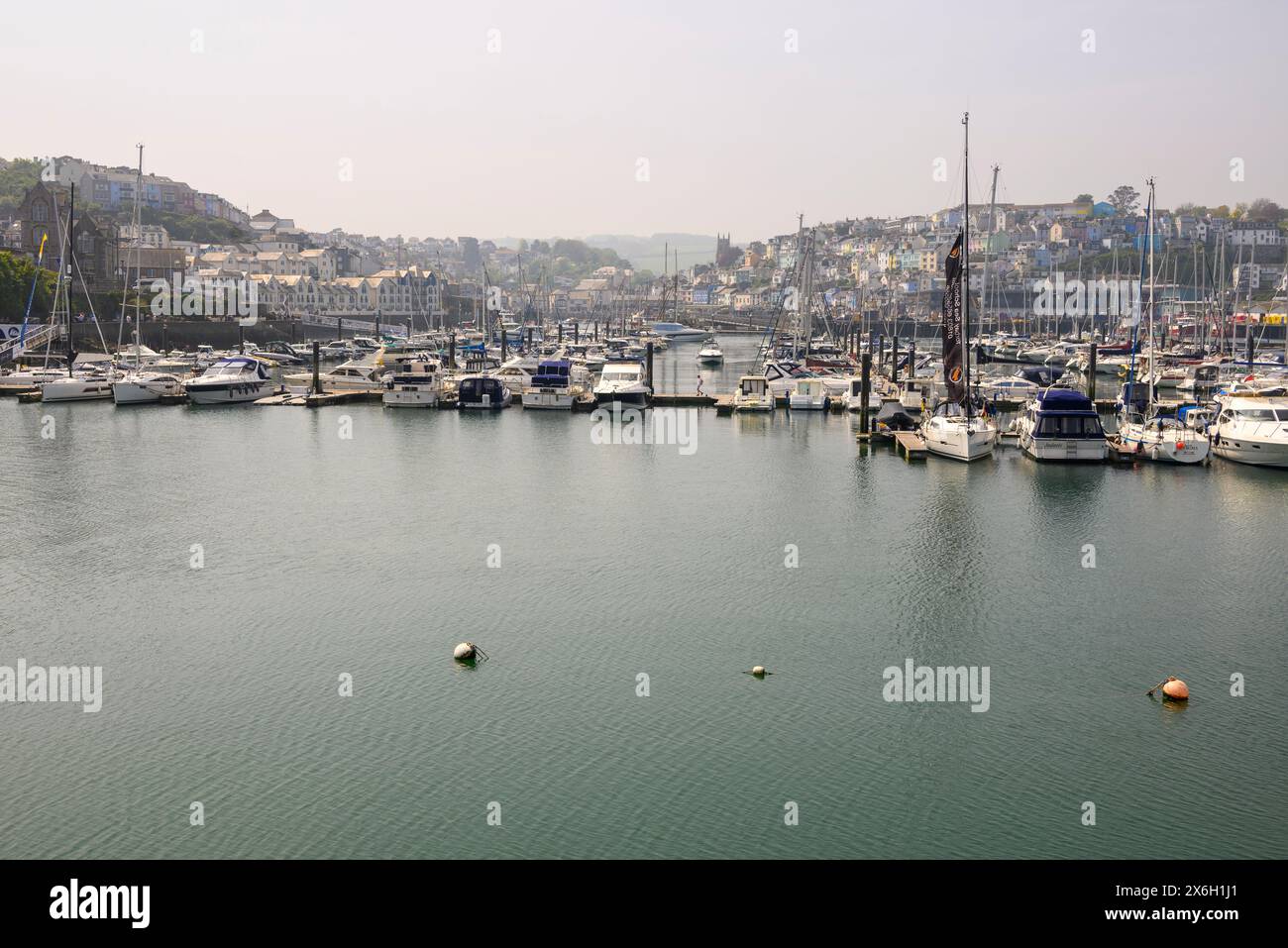 Marina and harbour, Brixham, Devon, England, UK in hazy sunshine in May ...