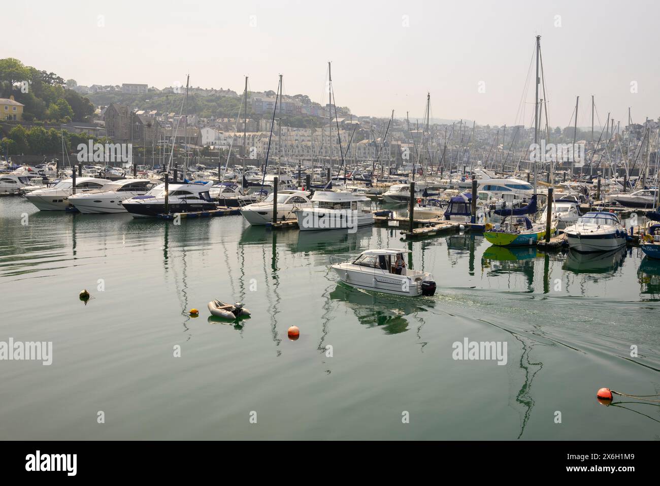 Marina and harbour, Brixham, Devon, England, UK in hazy sunshine in May ...