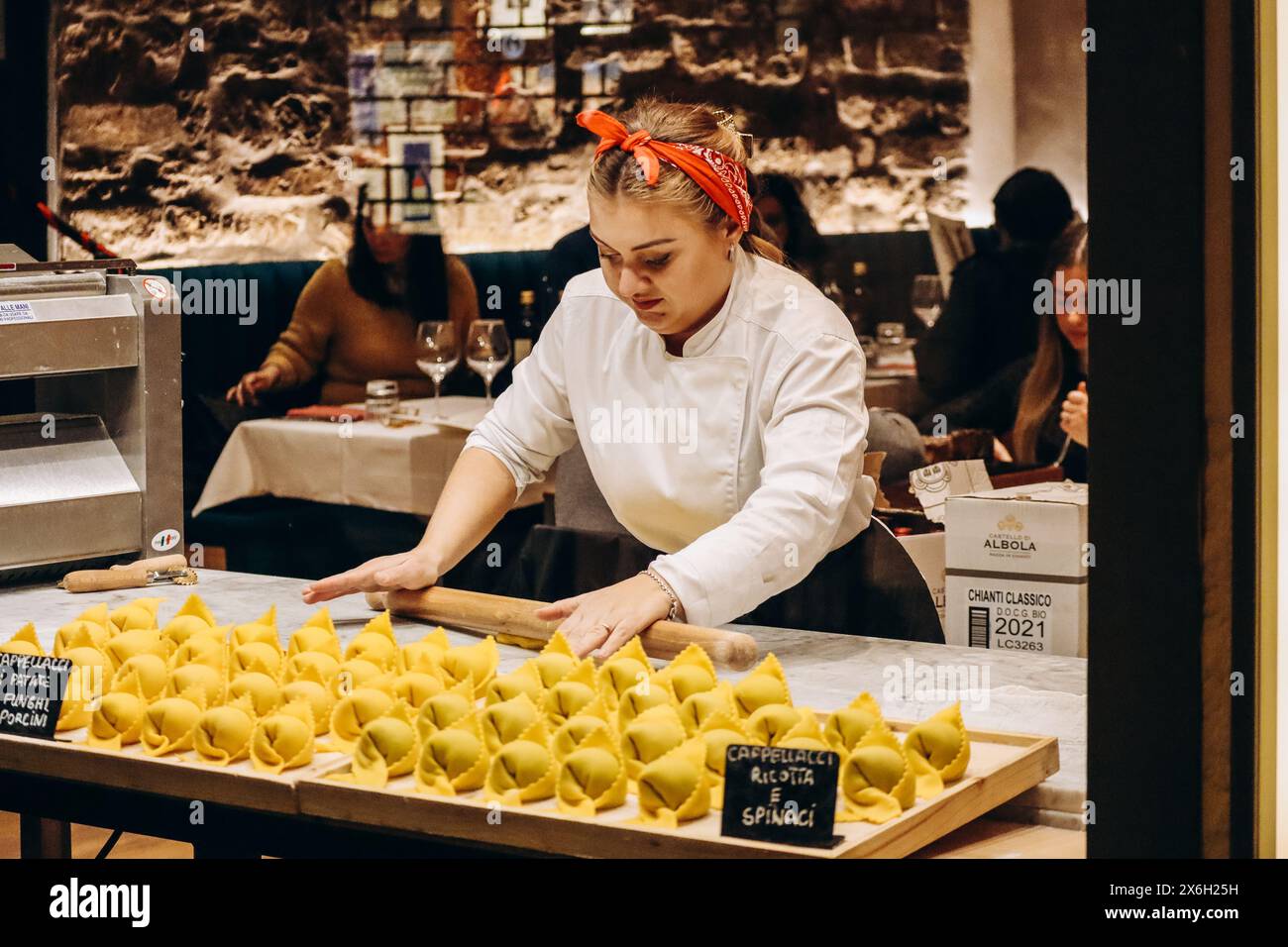 Florence, Italy - 29 December, 2023: The chef prepares the cappellacci ...