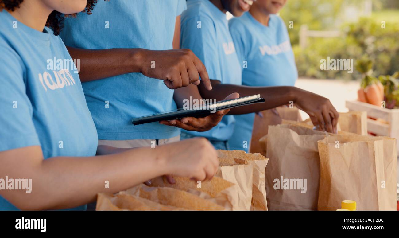 Volunteering, group of people and tablet for food donation, community ...