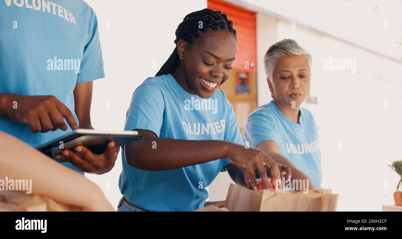 Volunteering, group of people and tablet for food donation, community ...