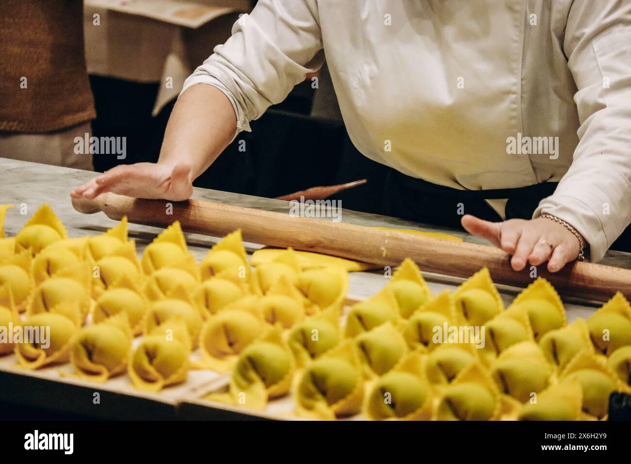The chef prepares the cappellacci with ricotta and spinach Stock Photo ...