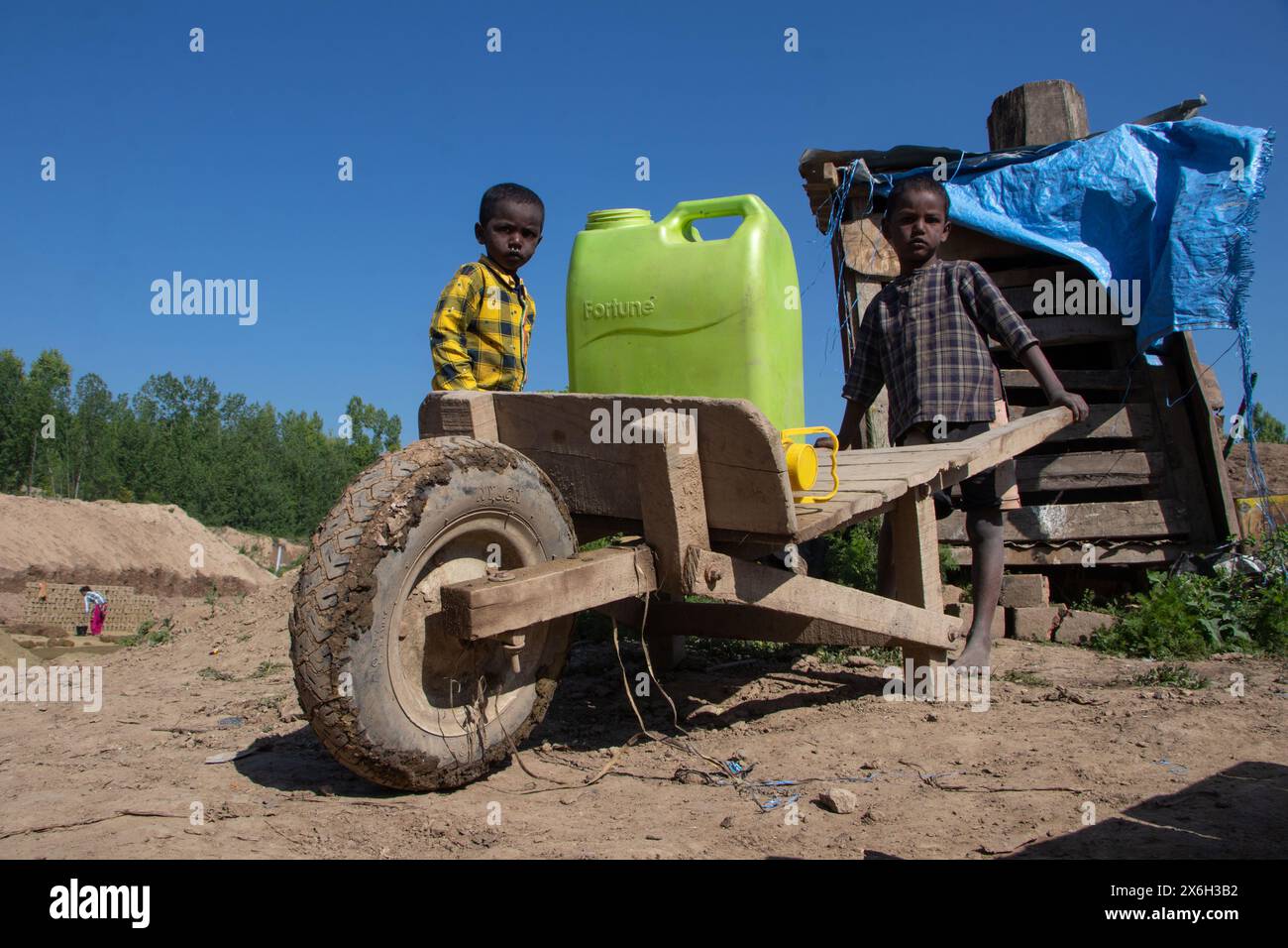 Boy drinking from water pump hi-res stock photography and images - Alamy