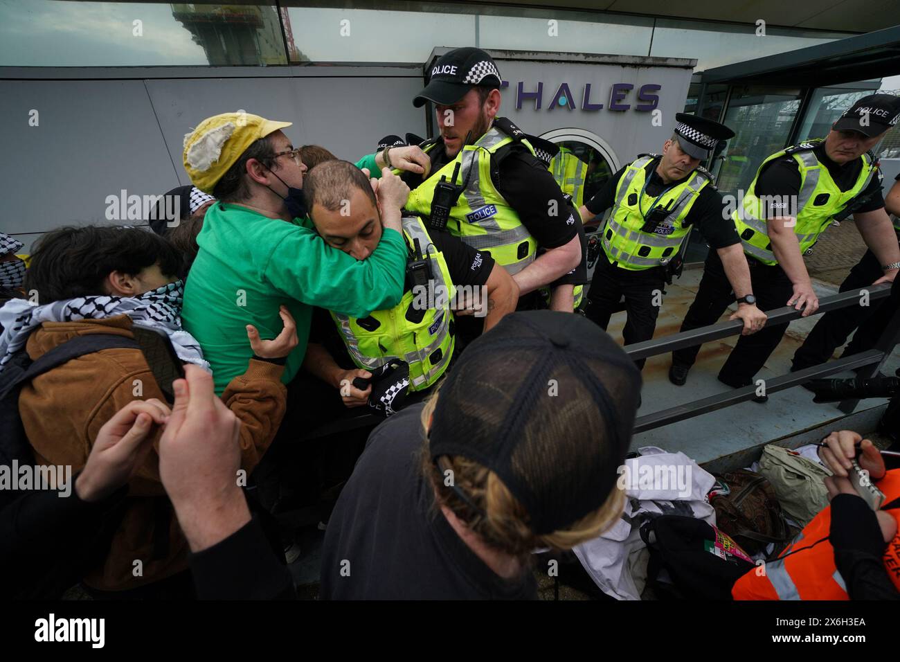 Pro-Palestine campaigners scuffle with police during a protest outside ...