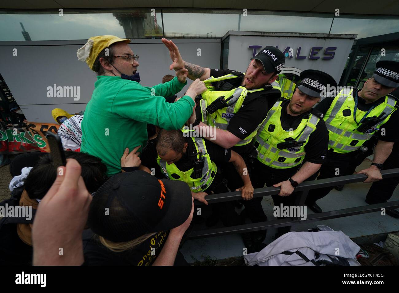 Pro-Palestine campaigners scuffle with police during a protest outside ...