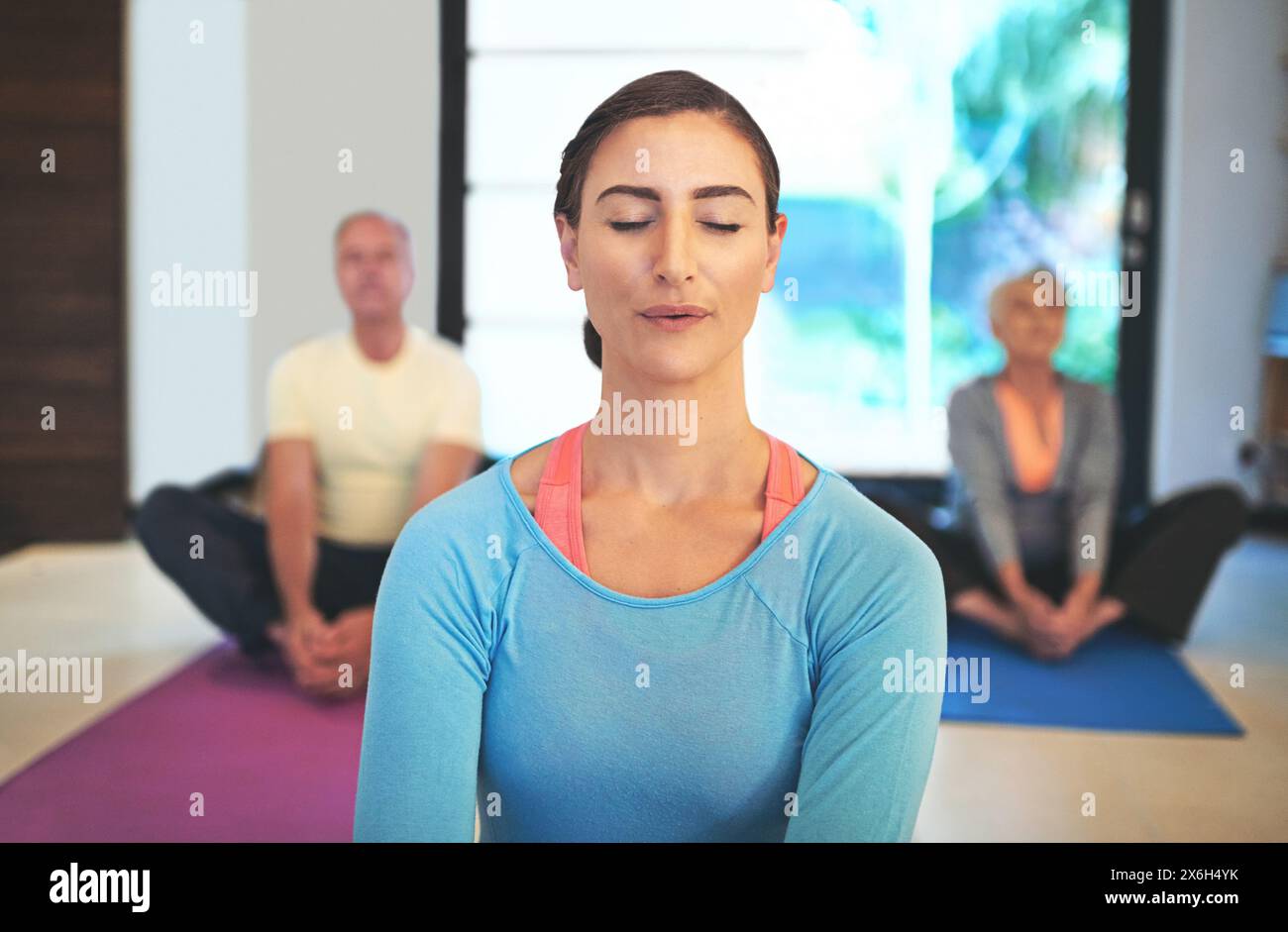 Female yoga instructor, elderly class and meditation in retirement ...