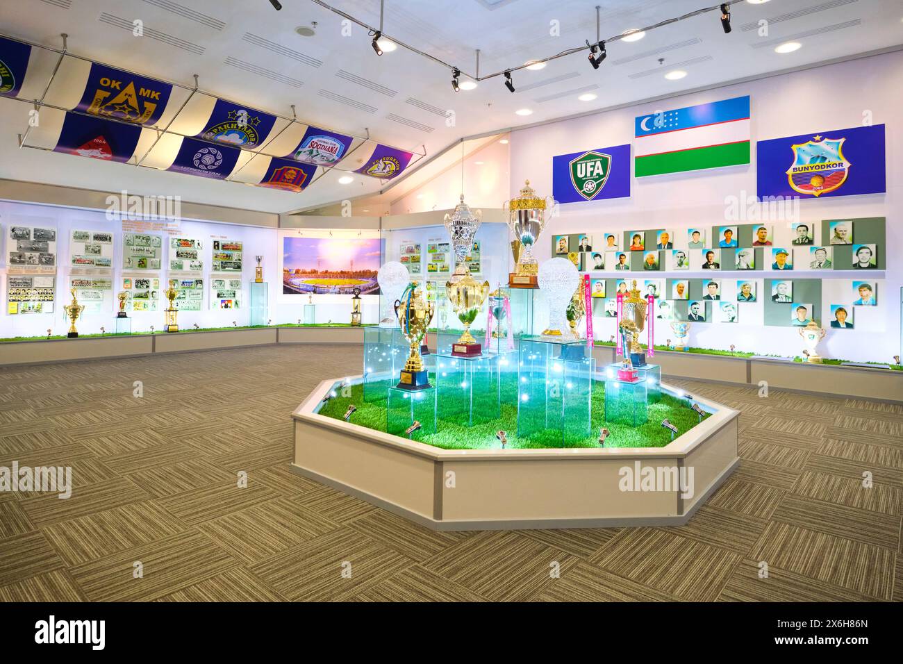 A timeline and various awards, trophies decorate the museum space. In ...