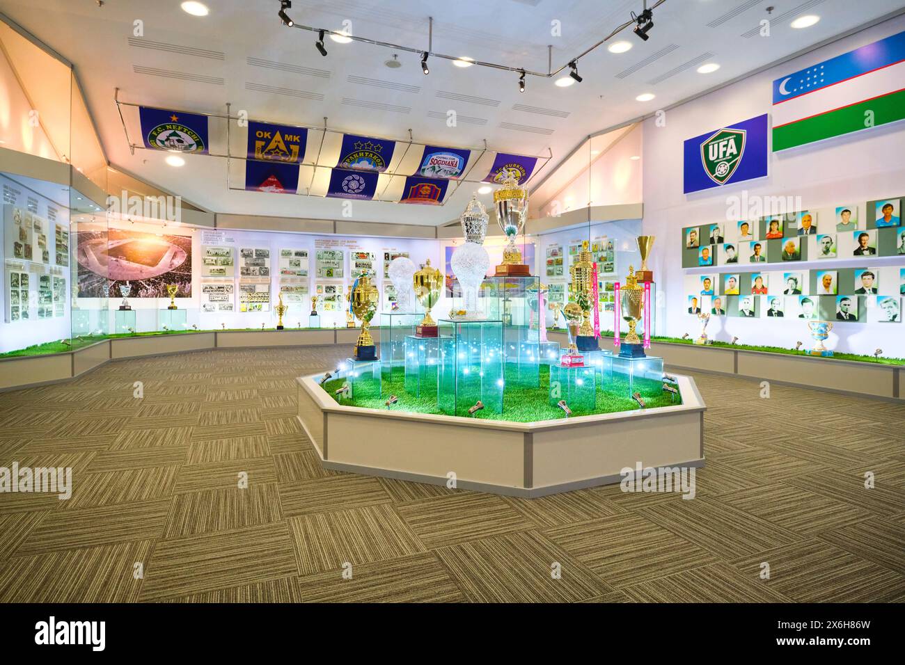 A timeline and various awards, trophies decorate the museum space. In ...