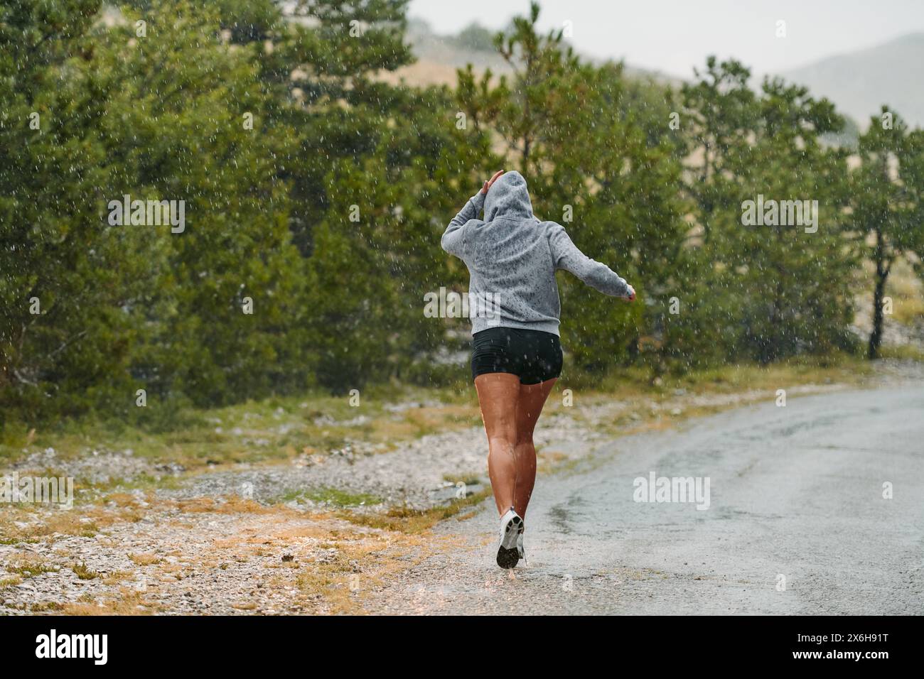 Unstoppable: A Determined Athlete Trains Through the Rain in Pursuit of ...