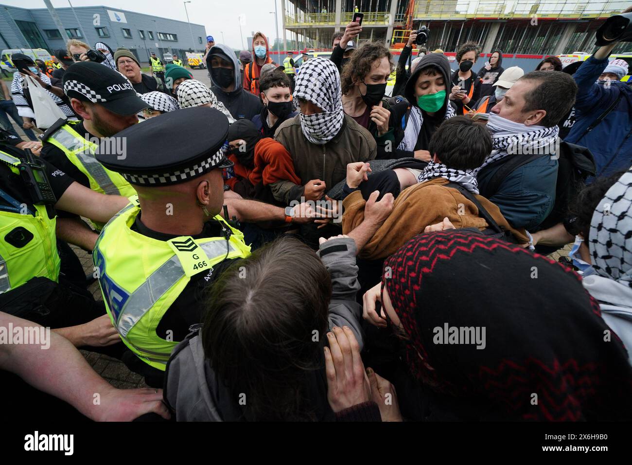Police attempt to remove a pro-Palestine campaigner during a protest ...