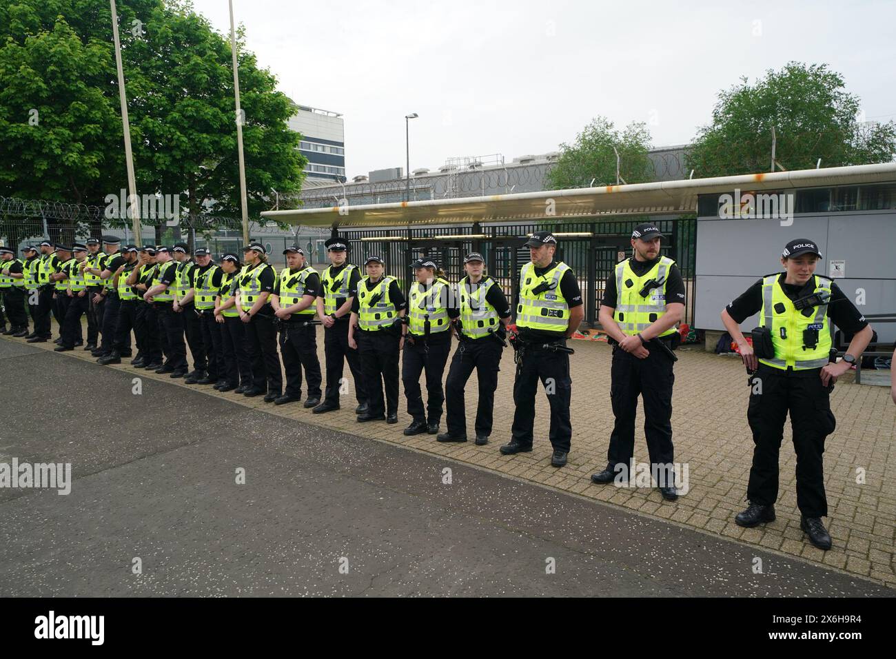 Police officers during a protest by pro-Palestine campaigners outside ...