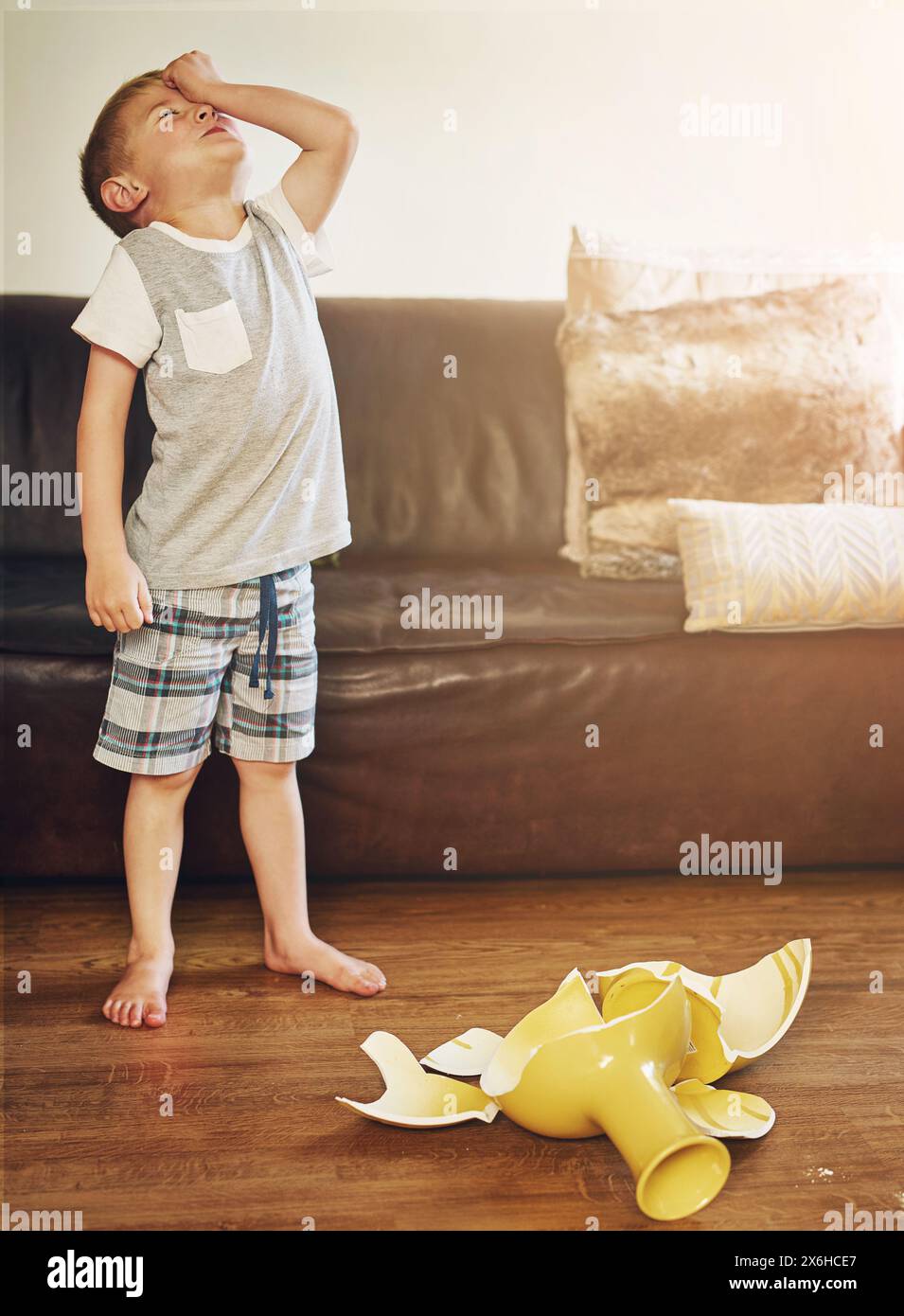 Boy with broken vase hi-res stock photography and images - Alamy