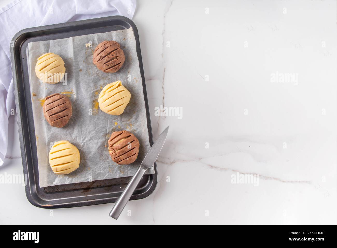 Cooking making mexican traditional conchas pastry, cookie or bread buns. Homemade preparation of ...