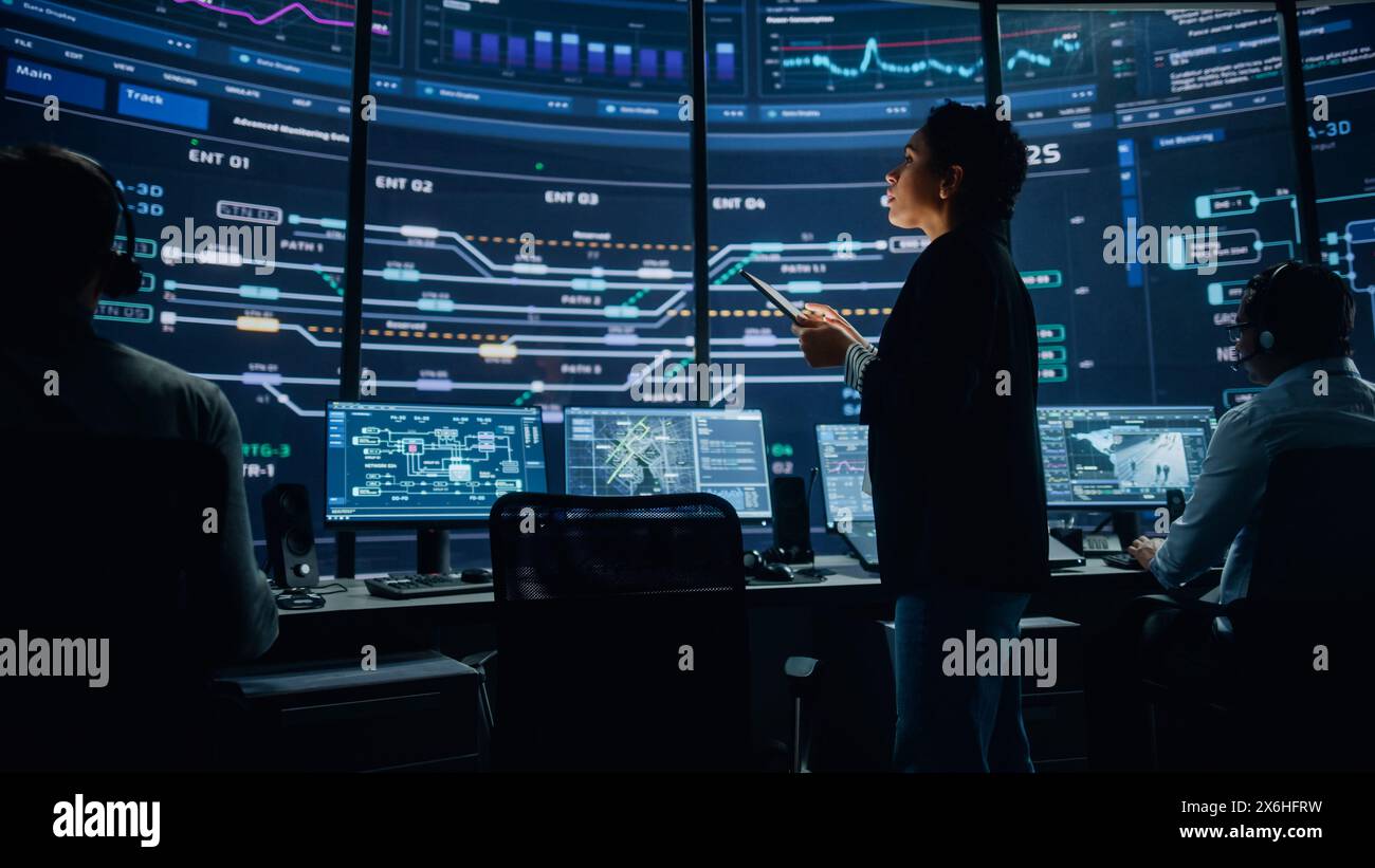 Young Multiethnic Female Government Employee Uses Tablet Computer in ...
