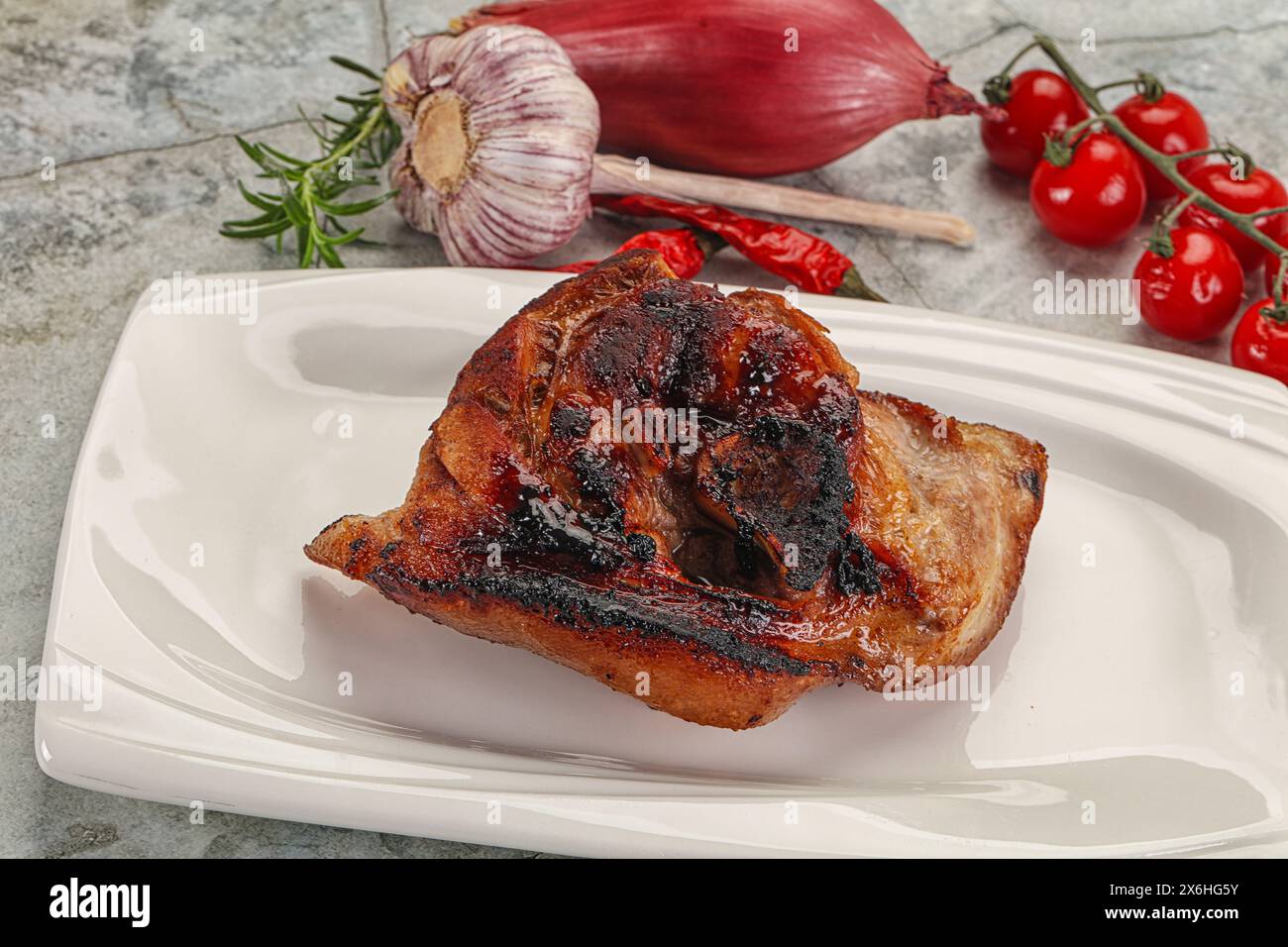 Roasted pork knuckle steak with bone Stock Photo - Alamy