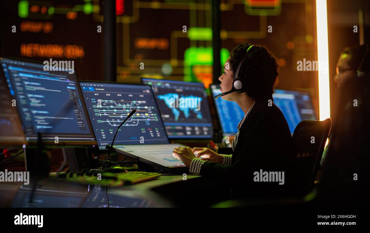 Multiethnic Female IT Technical Support Specialist Talking with a Client in Headphones and ...