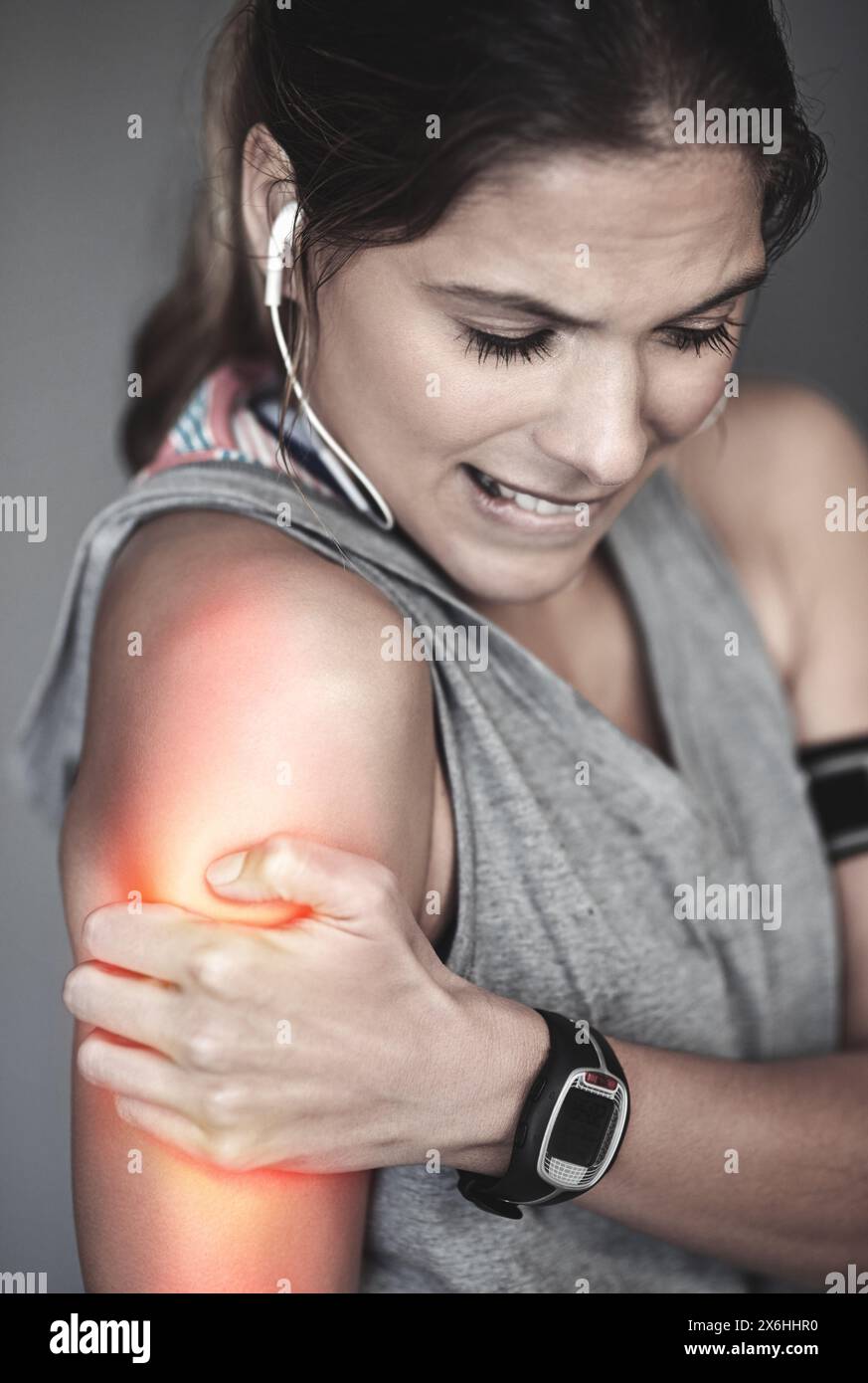 Woman, arm pain and injury for sports in studio with red glow, medical ...