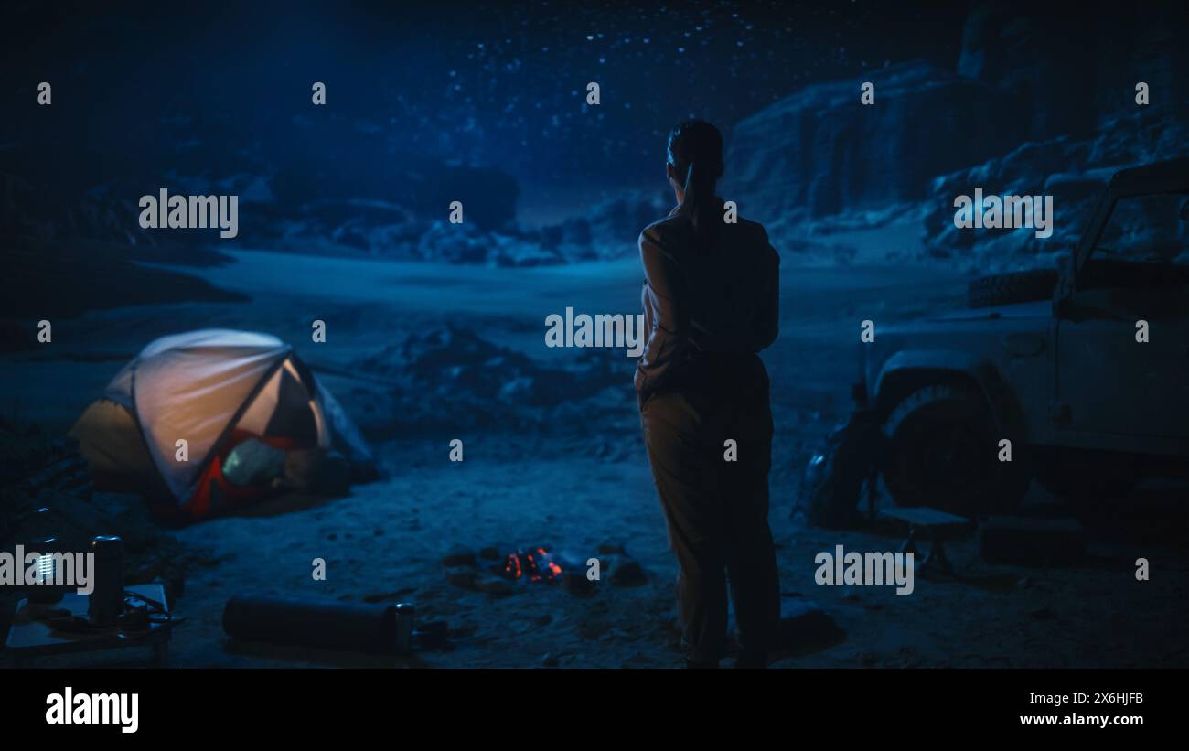 Female Traveler Watching Night Sky while Camping in the Canyon by ...