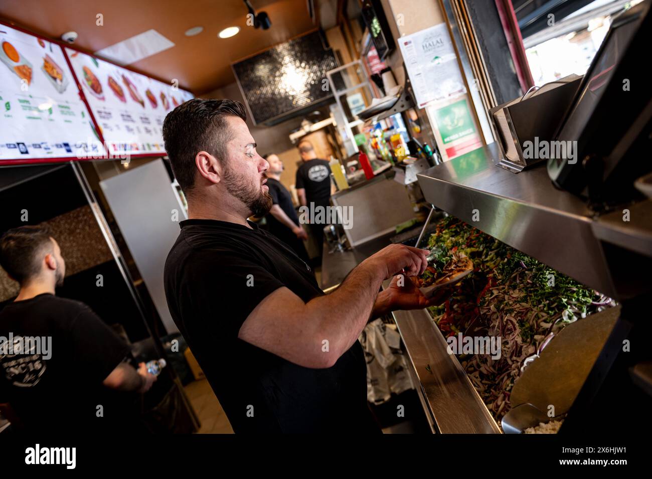 Berlin, Germany. 15th May, 2024. An employee of the kebab snack bar ...