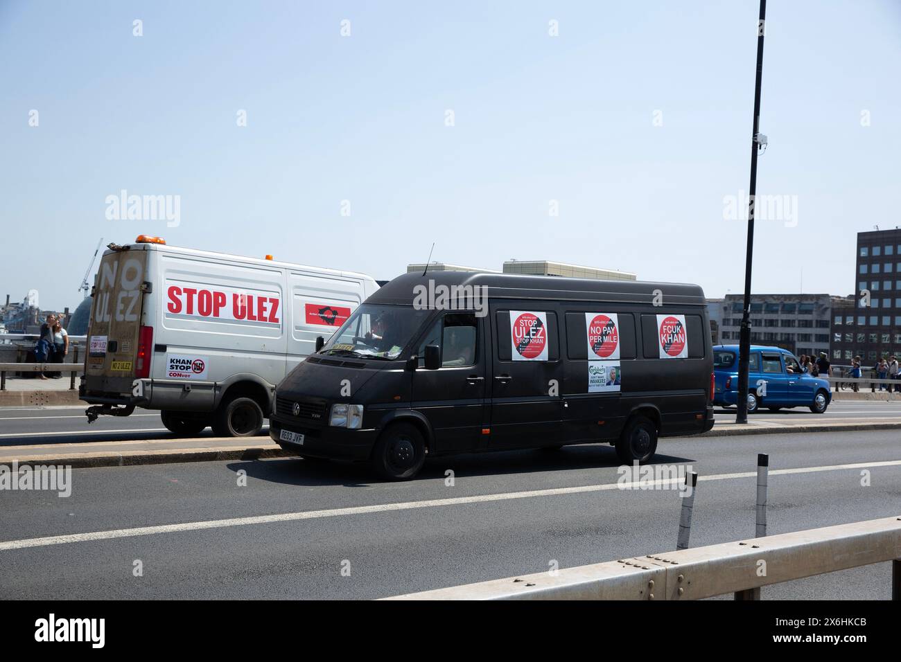 Vans with stickers are seen as participants gather for an anti-ULEZ ...
