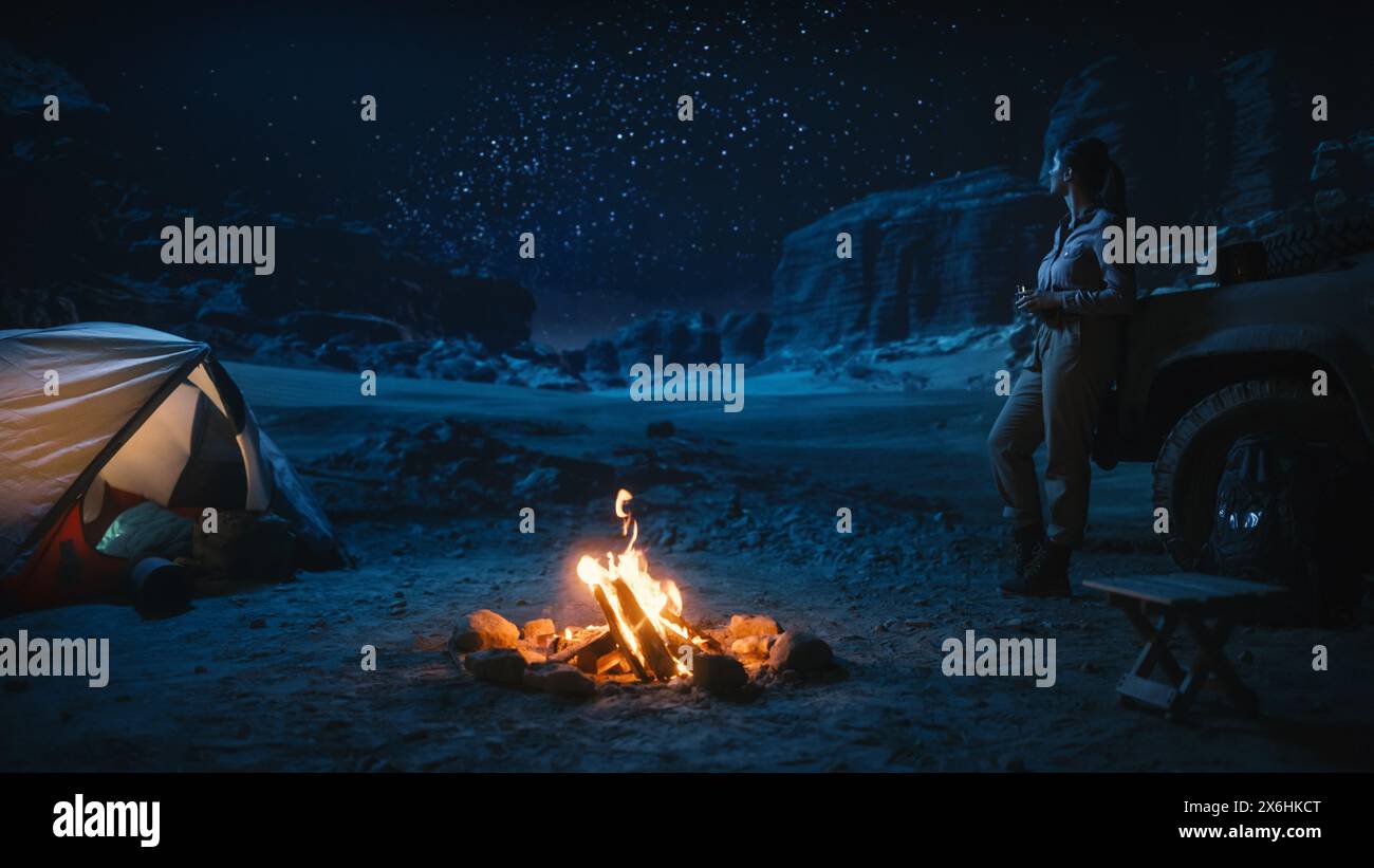 Female Traveler Watching Night Sky while Camping in the Canyon by ...
