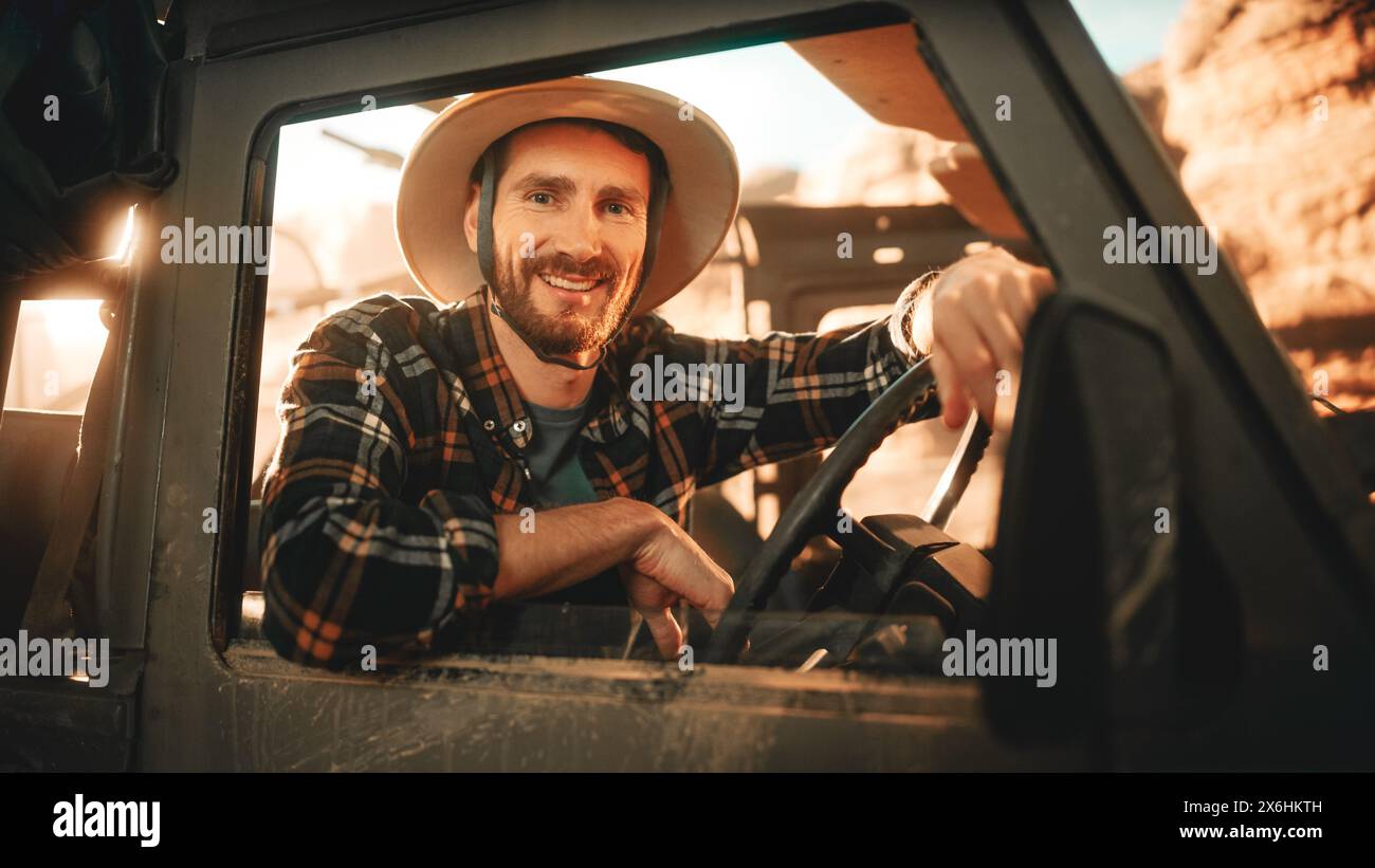 Desert Road Trip: Portrait of Handsome Male Explorer Looking out of Car ...