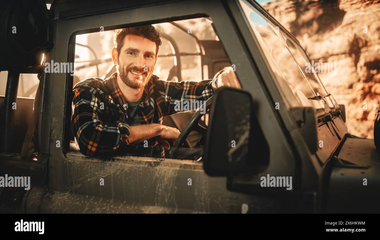 Desert Road Trip: Portrait of Handsome Male Explorer Looking out of Car ...