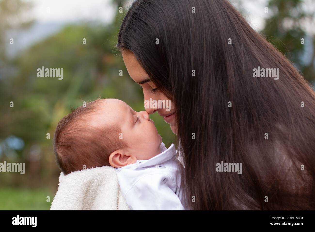 lifestyle: Eskimo kiss between mother and baby Stock Photo - Alamy