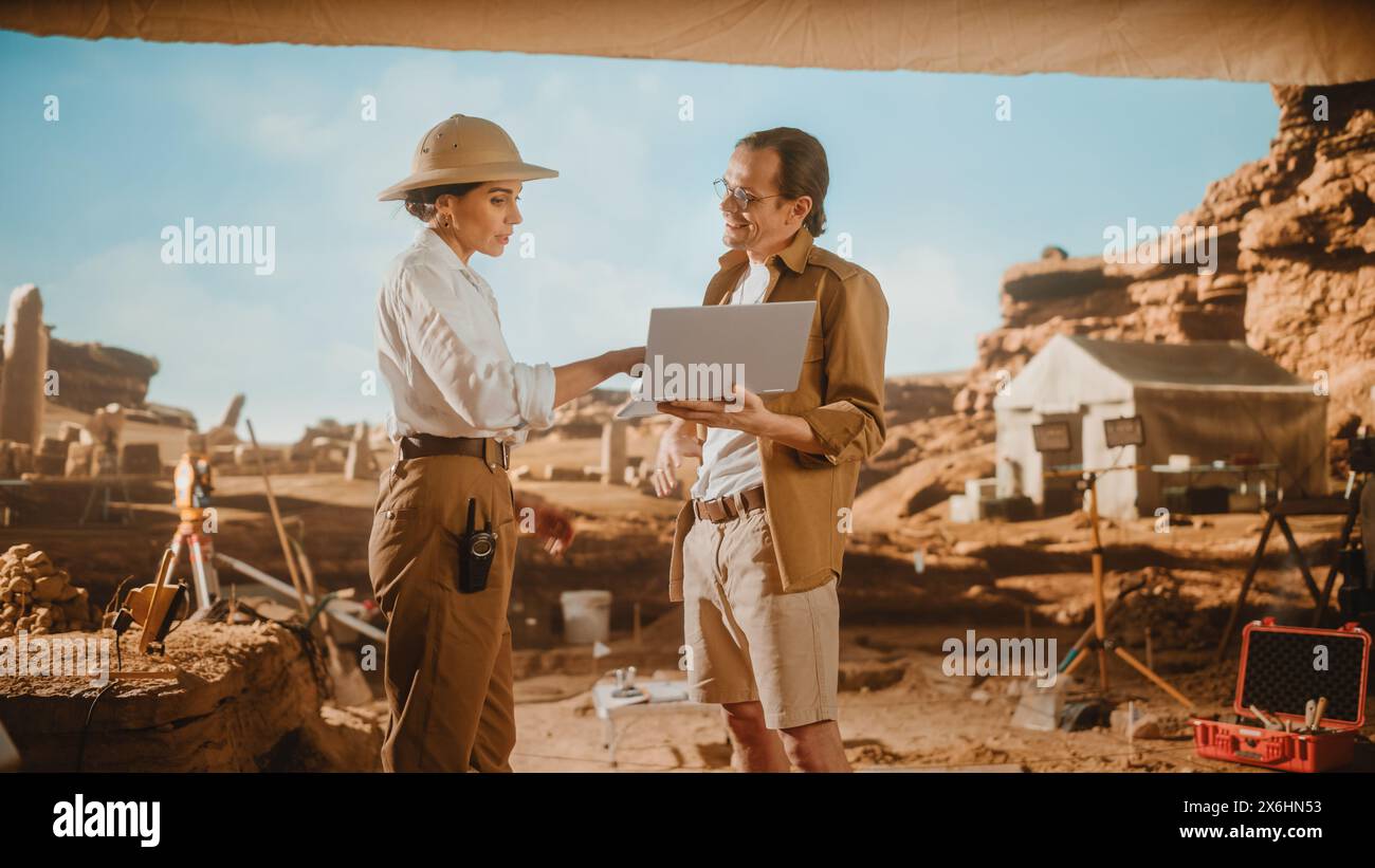 Archeological Digging Site: Two Great Archeologists Stand in Tent Work ...