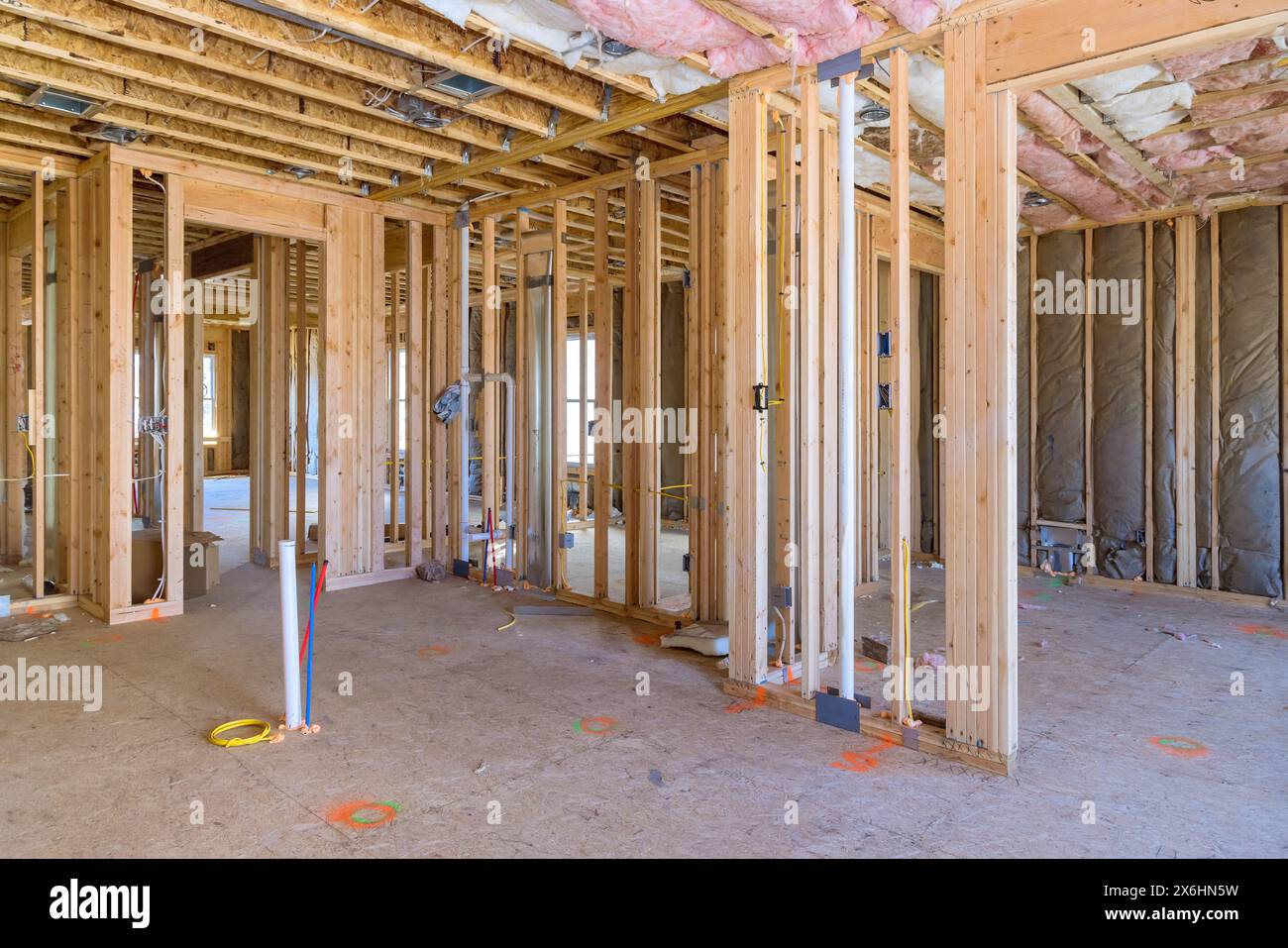 Under construction, new home is framing an unfinished wood frame with ...